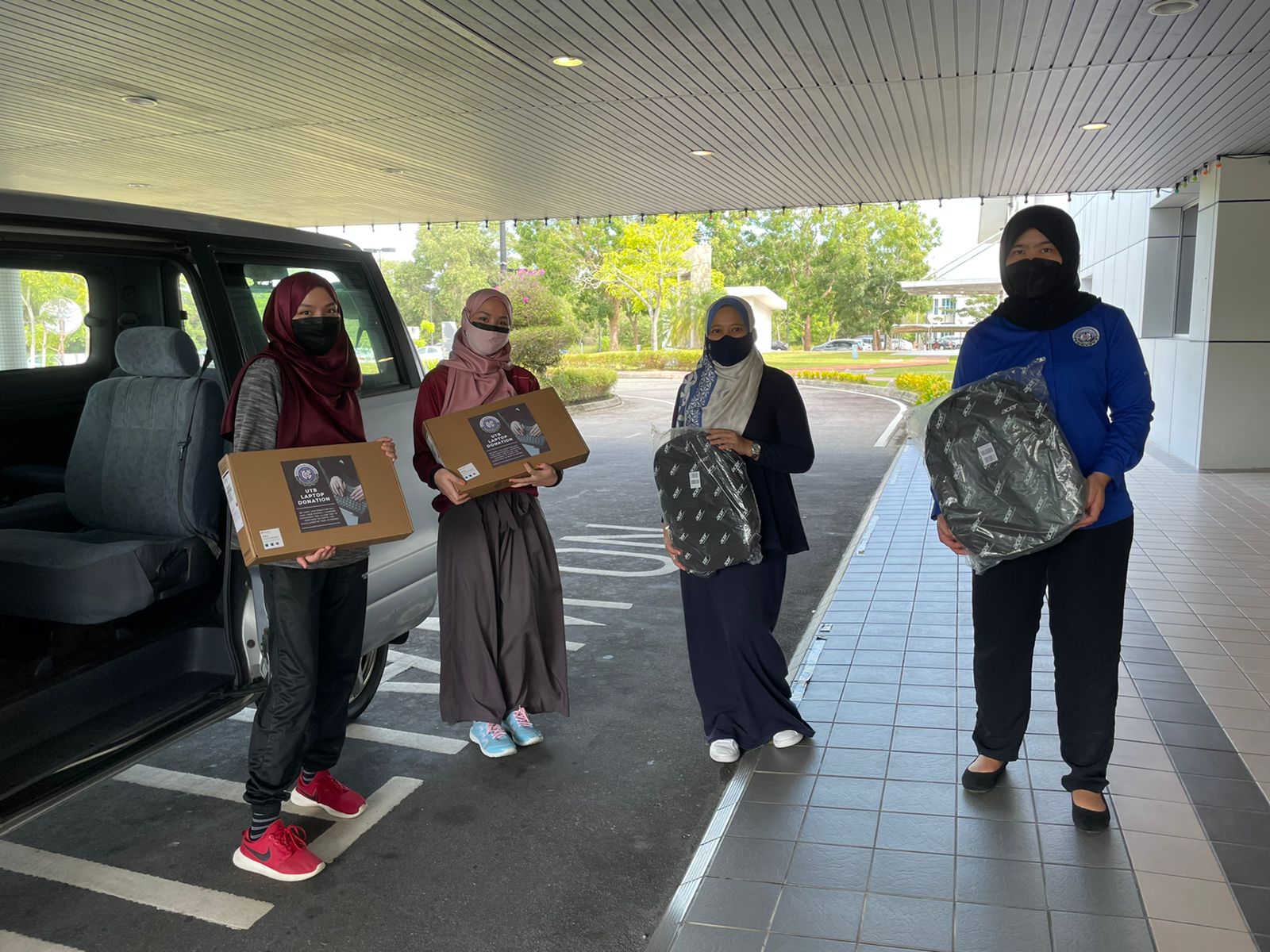 UTB HOLDS UTB LAPTOP DONATION - EB
